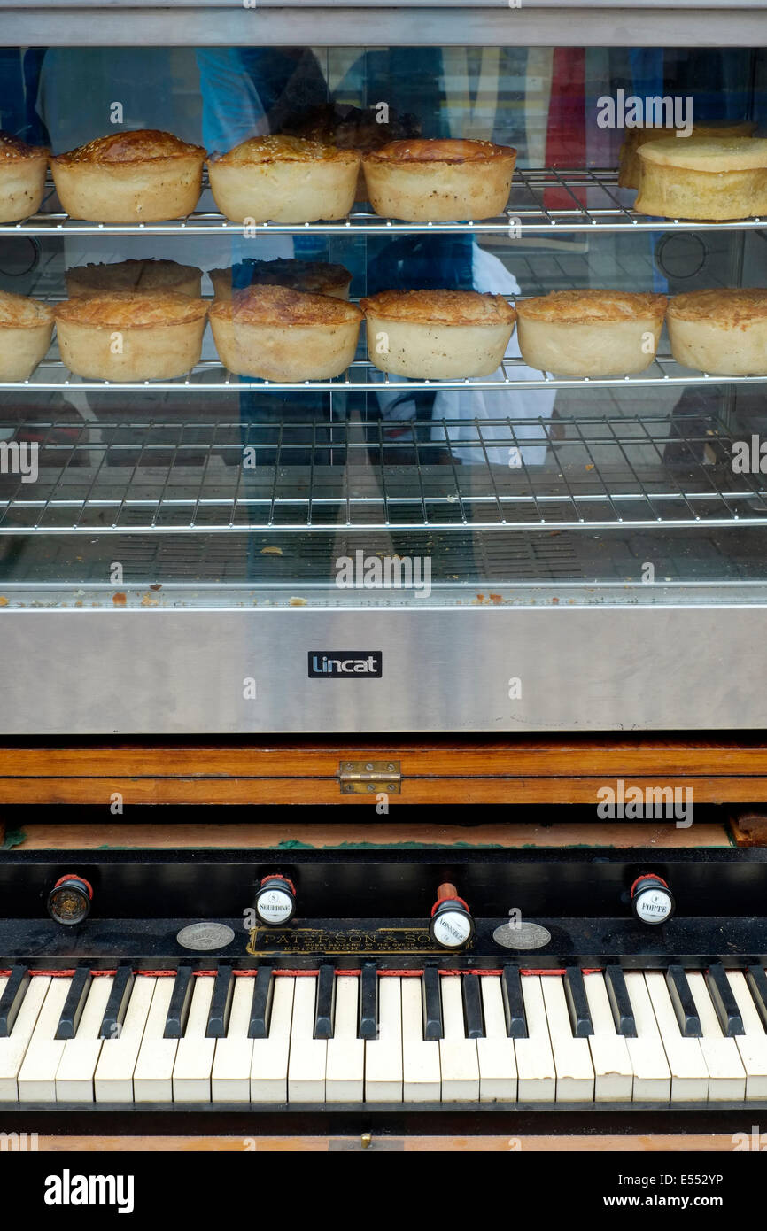 pies cooking in oven on top of an organ at the southsea food fair ...