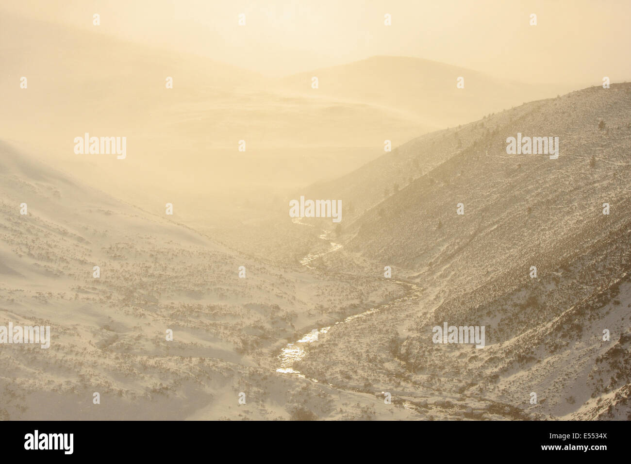 View of upland river valley with 'Spindrift' of fine snow blown off by ...