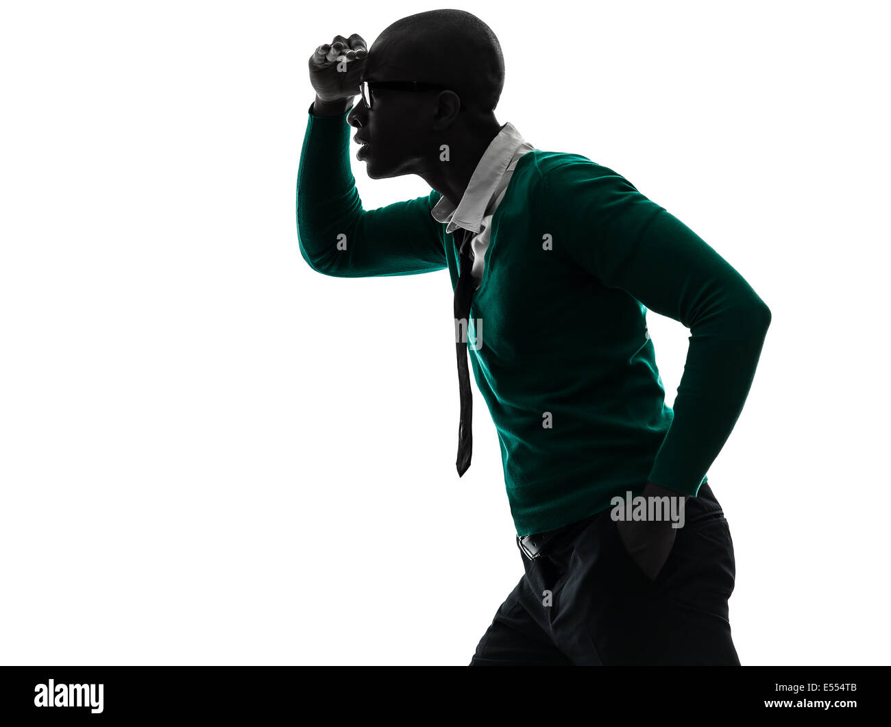 one african black man looking away worried in silhouette studio on ...