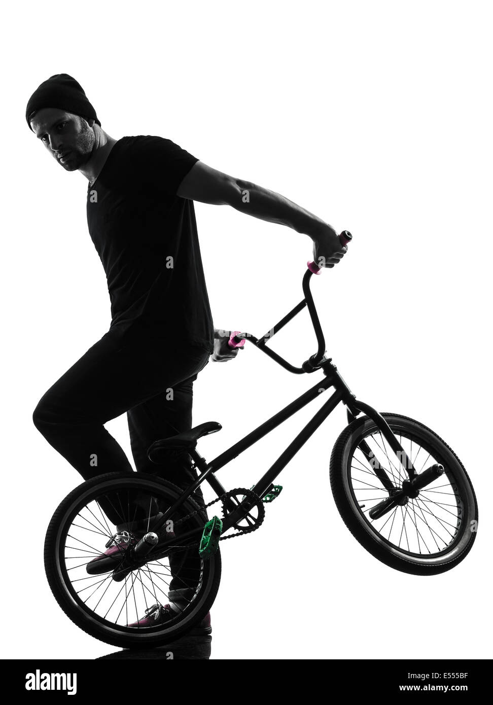 one man exercising bmx acrobatic figure in silhouette studio isolated ...