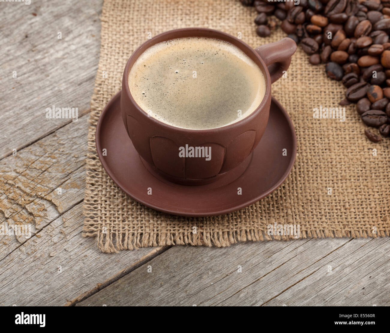 Coffee cup and beans on wooden table background Stock Photo - Alamy
