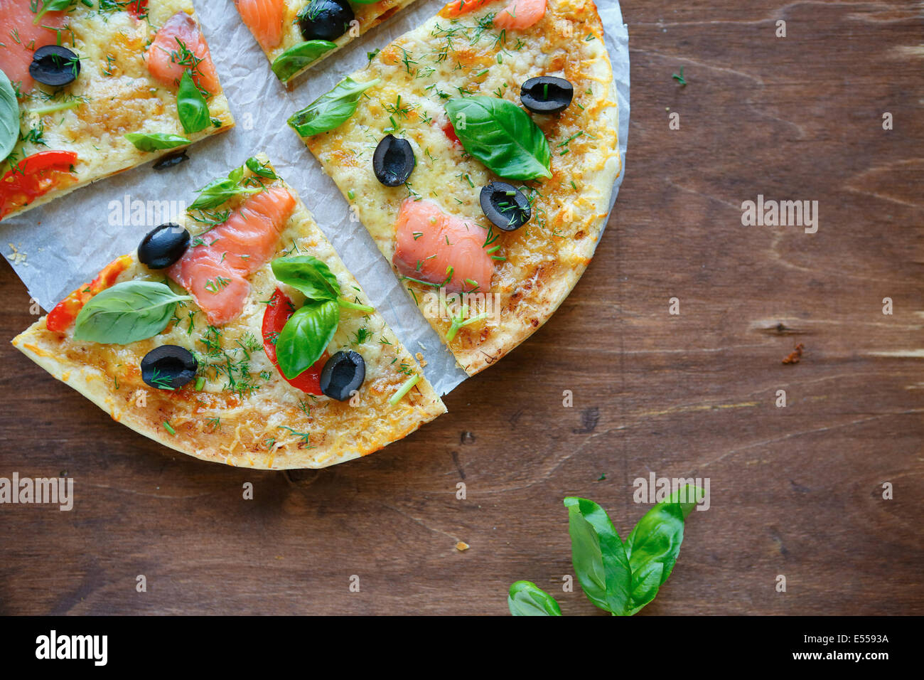 thin crispy pizza with fish, food Stock Photo - Alamy