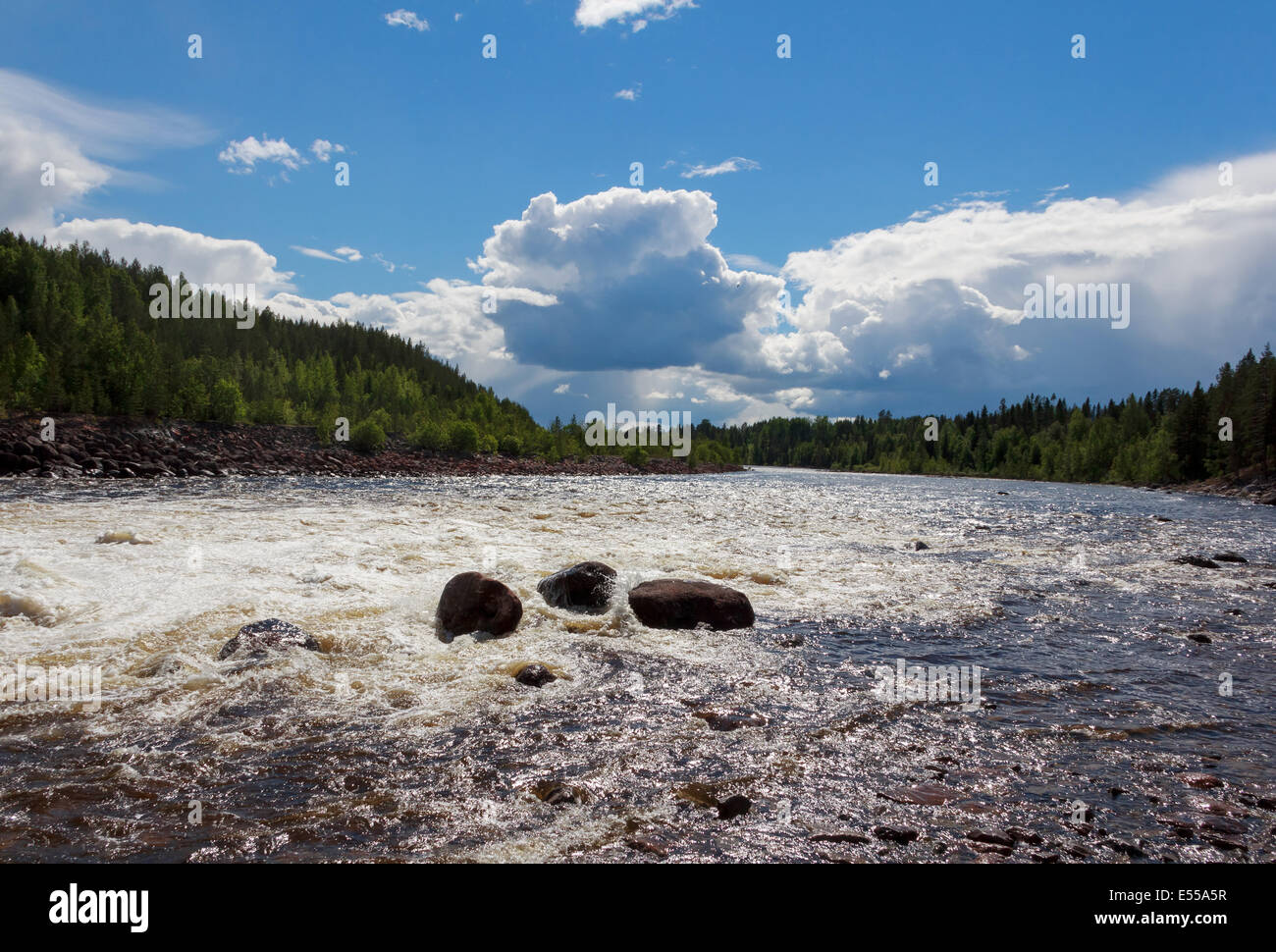 River with three rocks Stock Photo - Alamy
