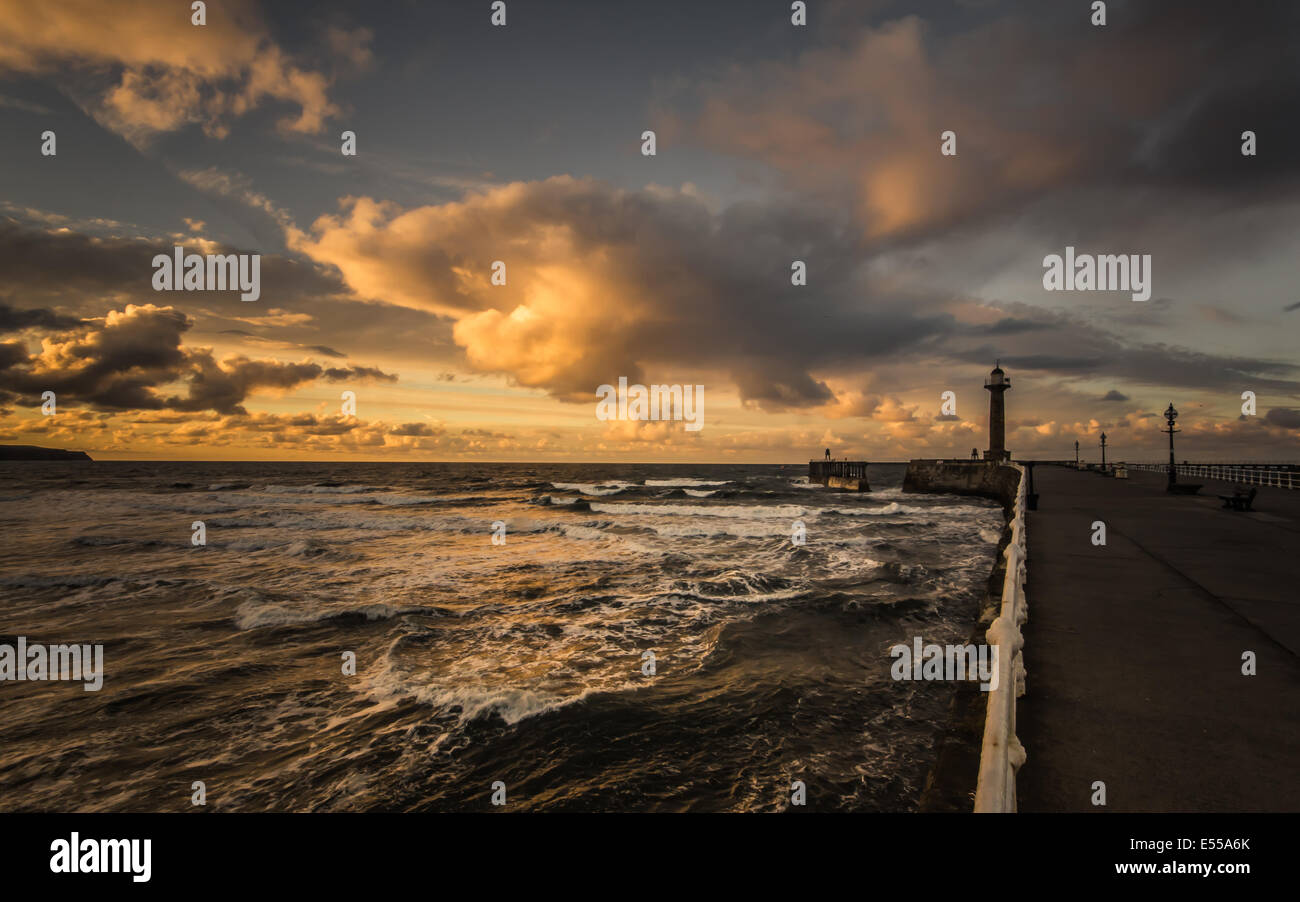 Whitby Pier - Whitby Pier against a dramatic cloudy sky Stock Photo - Alamy