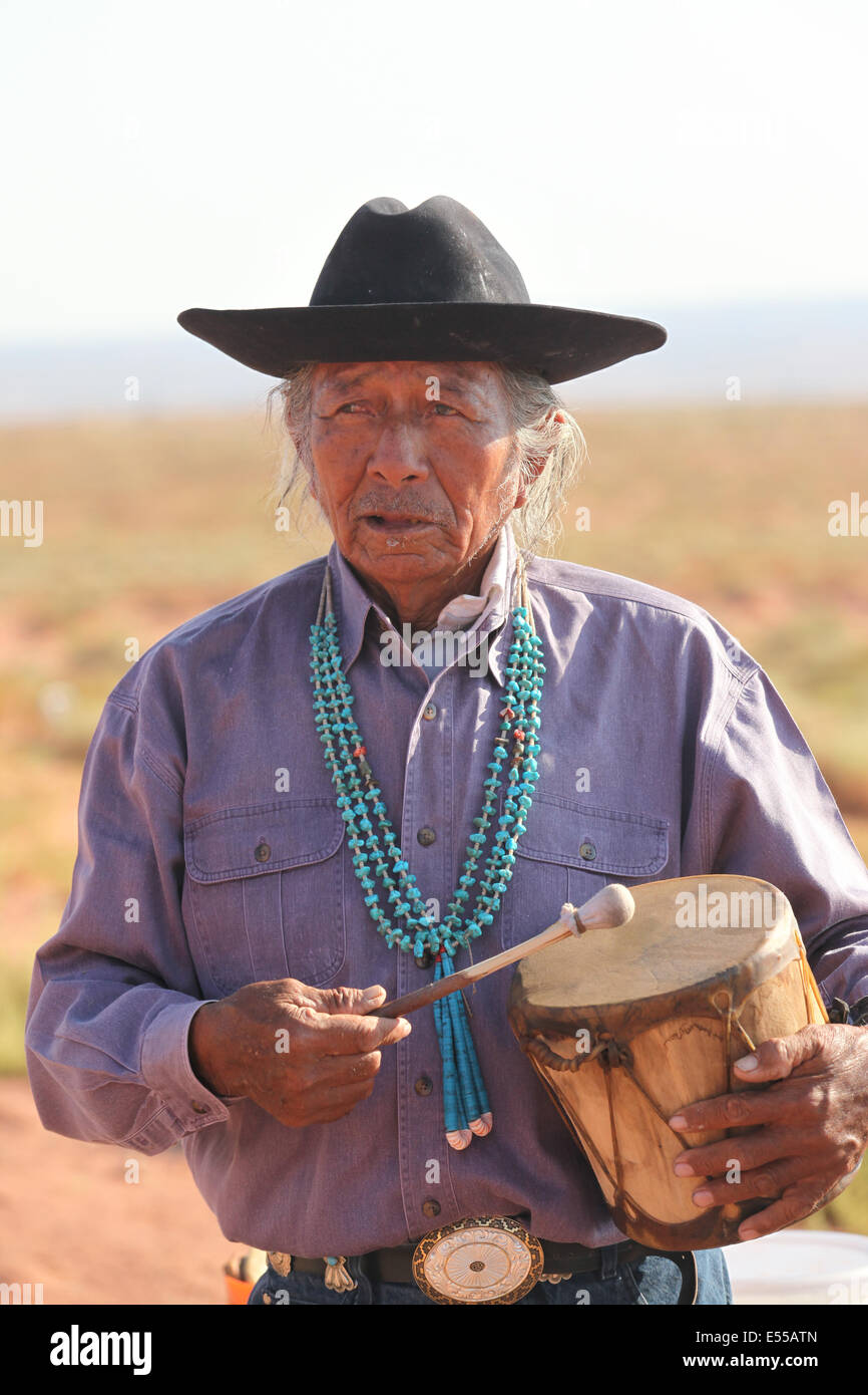 Native american man, Navajo indian, in Monument Valley, USA, with drums ...