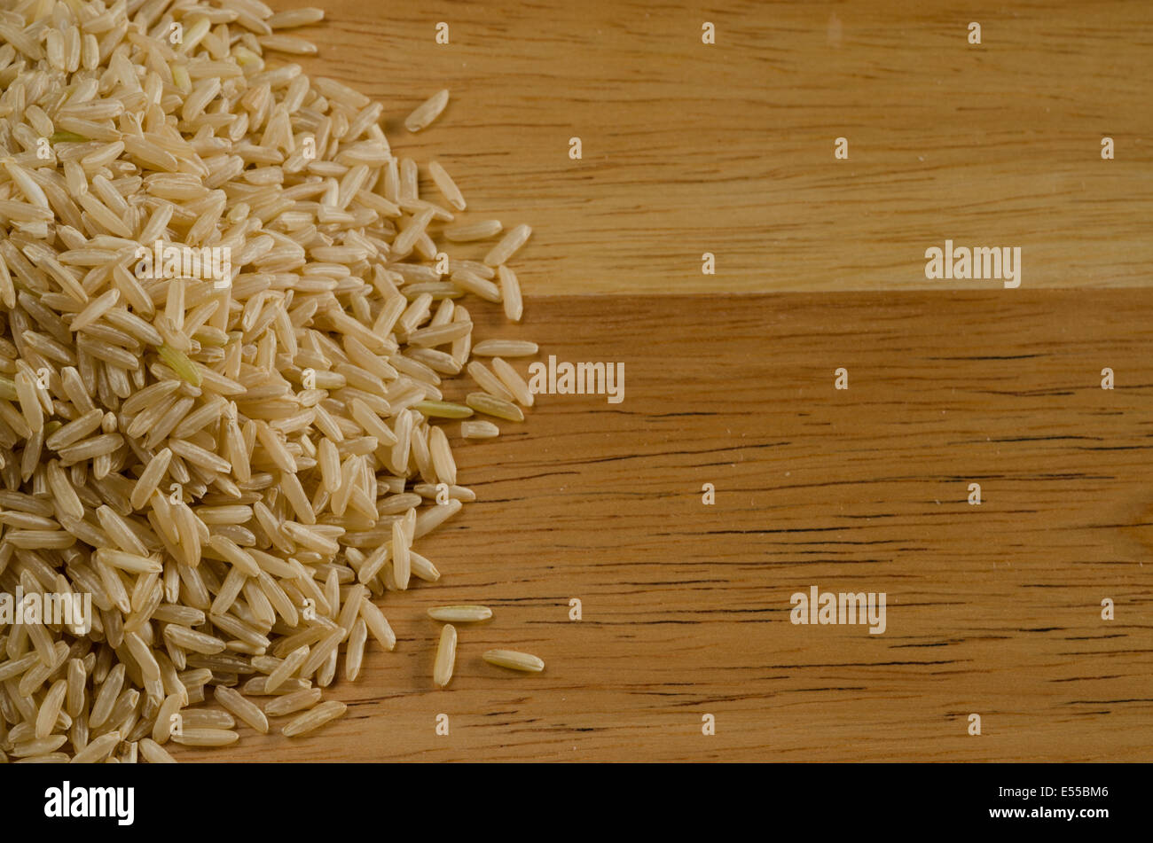 brown rice on wood Stock Photo - Alamy