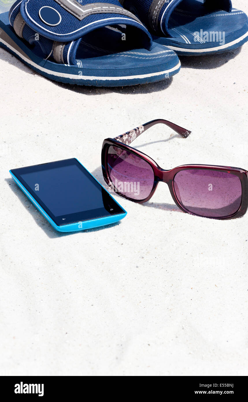 Mobile Phone and Sunglasses in the Sand on the Beach Stock Photo - Alamy