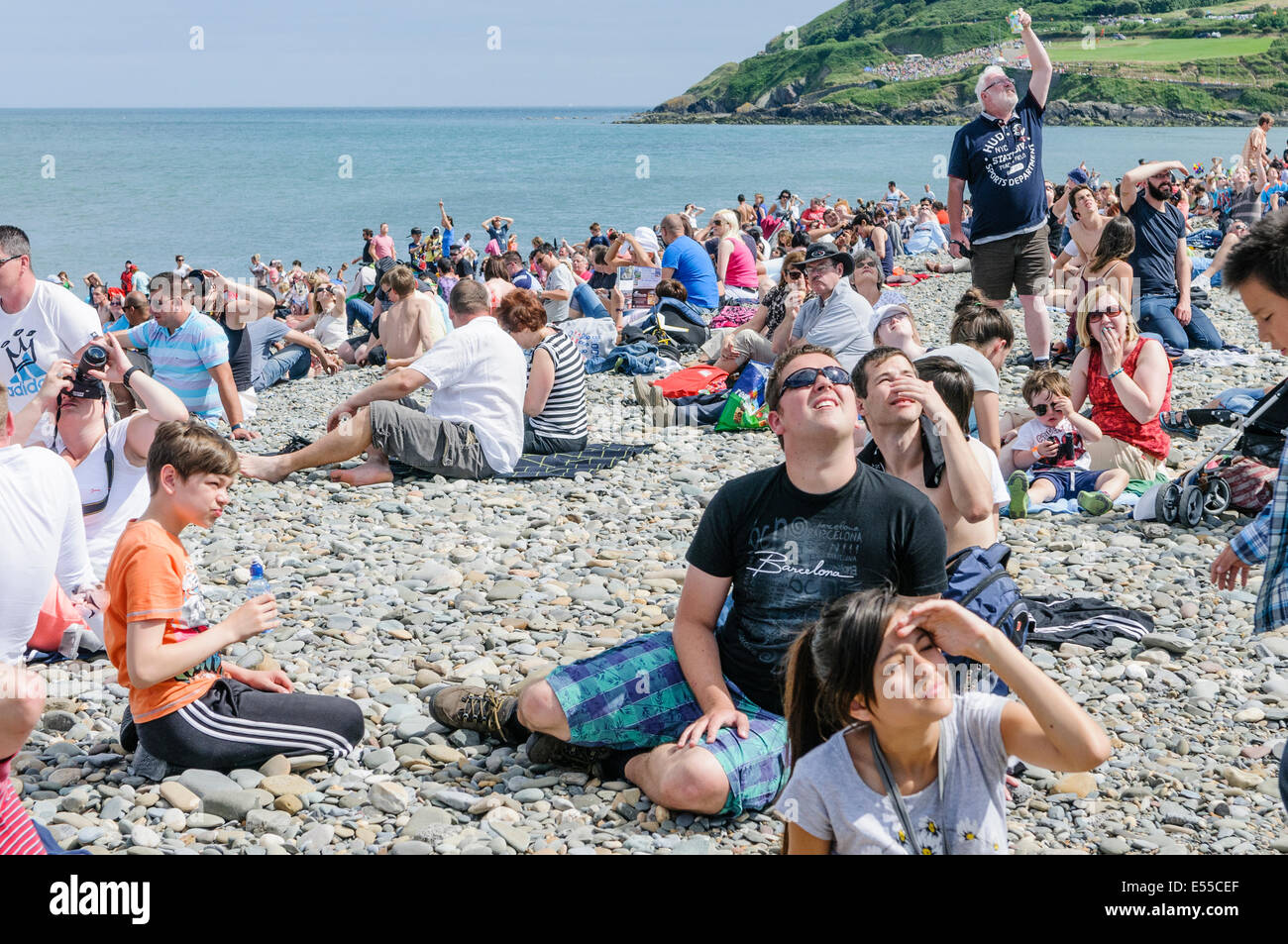 Crowd Looking Up At Sky