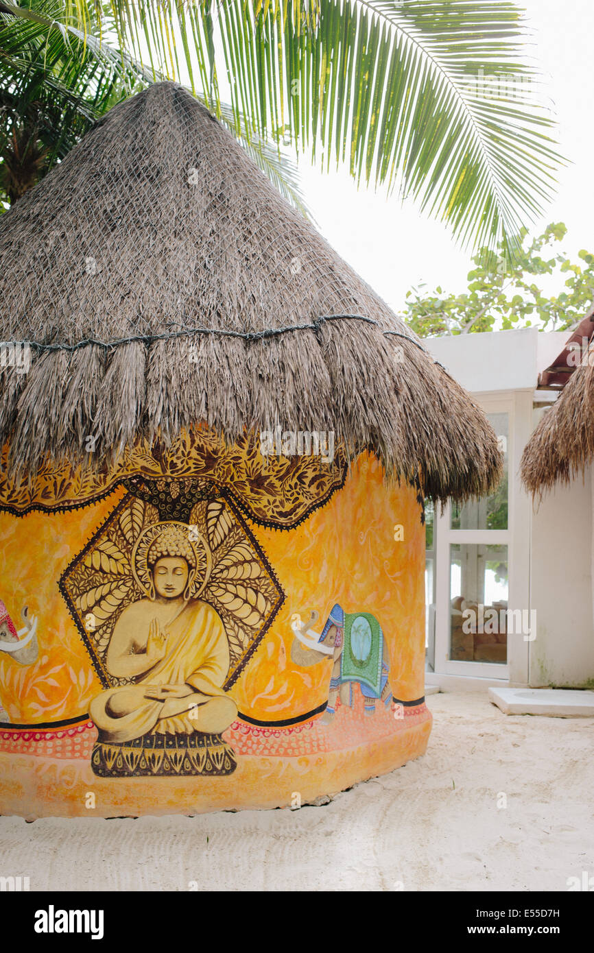 Palapa with painting of Hindu deity in orange and brown Stock Photo - Alamy