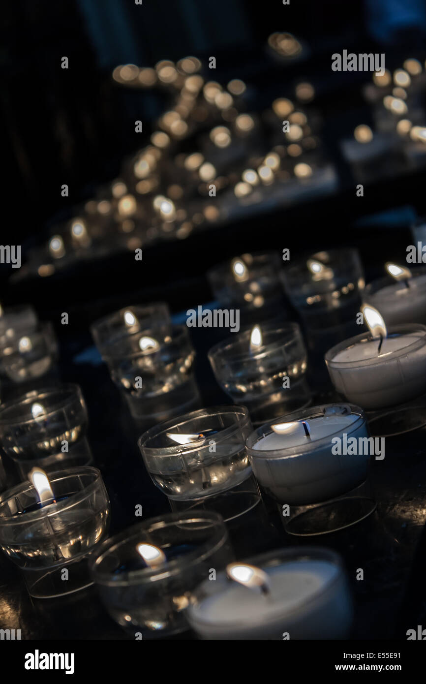 Romantic glowing long row of candlelight burning Stock Photo - Alamy
