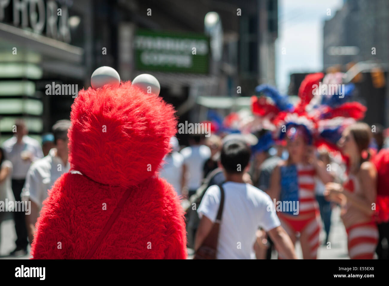 Elmo solicits tourists in Times Square in New York on Friday, July 18 ...