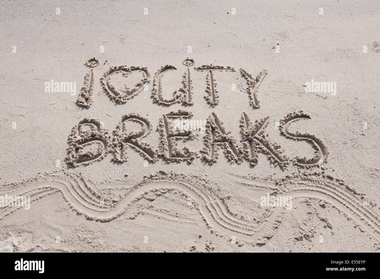 I Love City Breaks message written on sand, vacation concept Stock ...