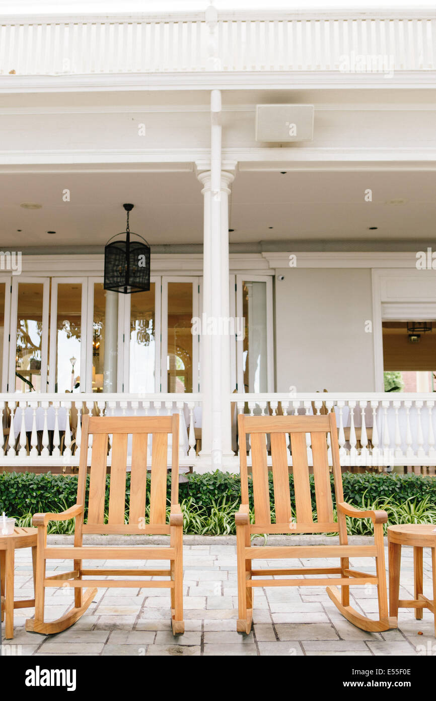 Two wood rocking chairs on the patio of a luxury resort in Hawaii Stock ...