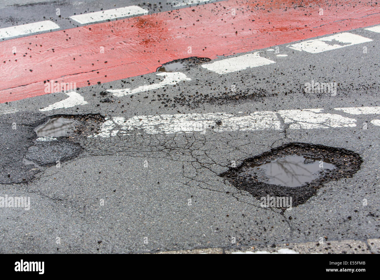 Road with potholes, inner city road Stock Photo - Alamy