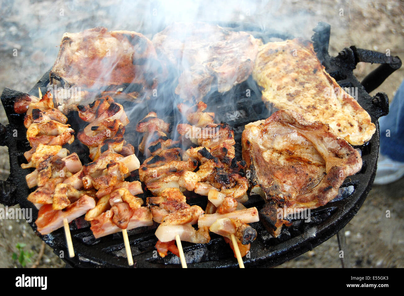 Grilled meat, prepared for a family lunch Stock Photo - Alamy