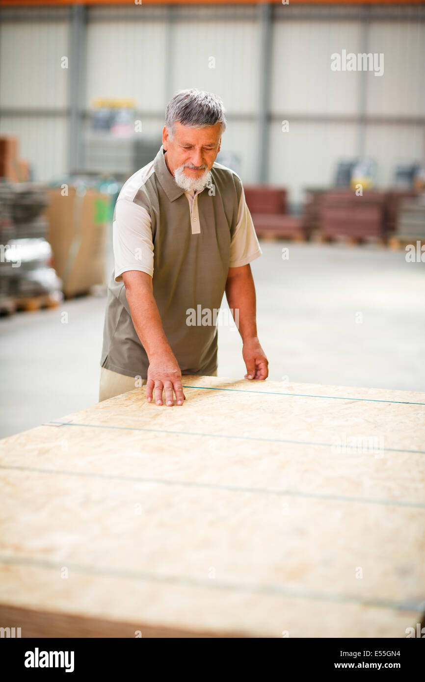 Man choosing and buying construction wood in a DIY store for his DIY ...