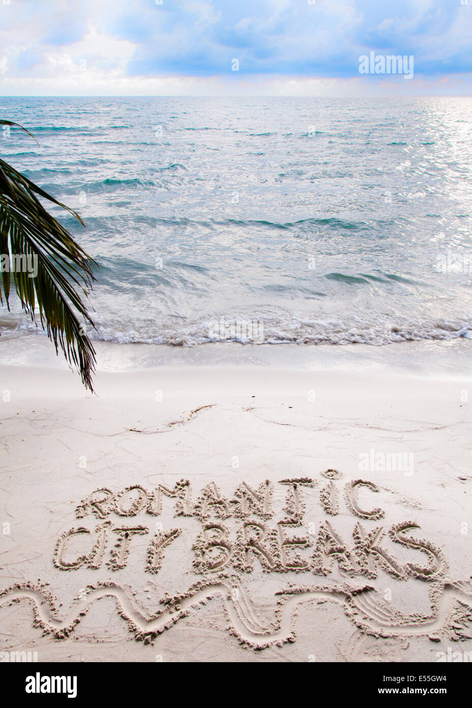 Romantic City Breaks message written on sand, vacation concept Stock ...