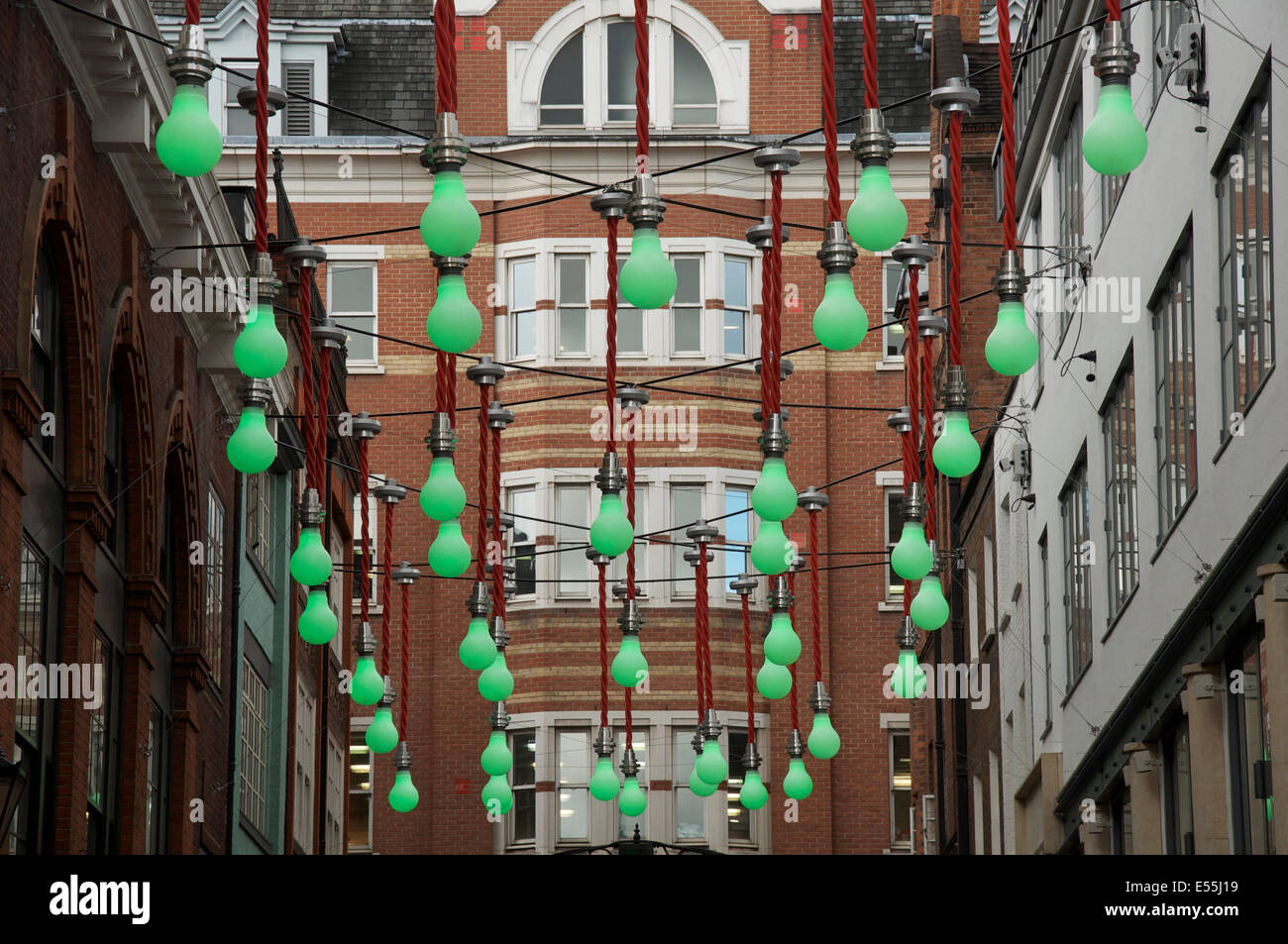 A decorative display of large light bulbs dangling above the ...