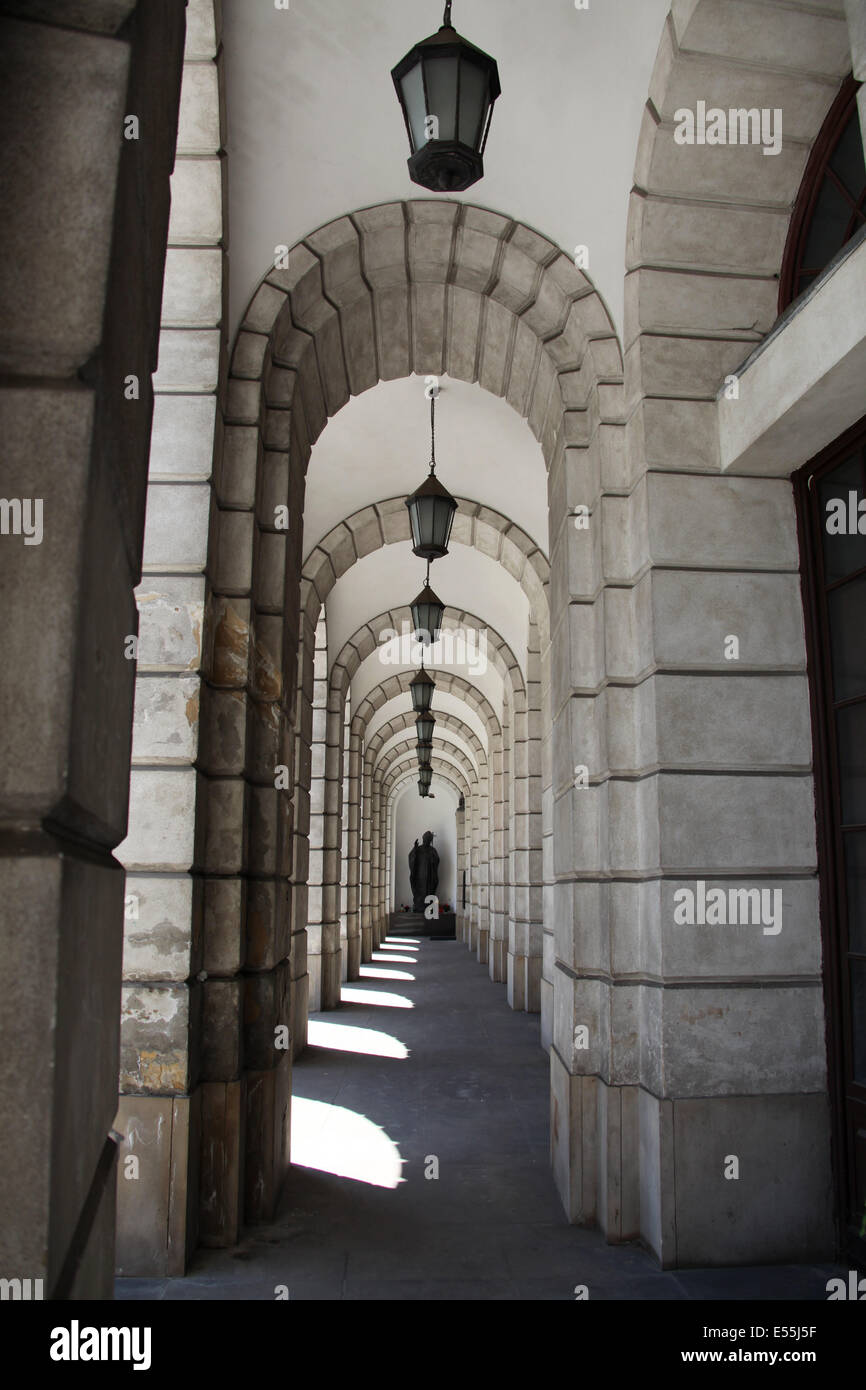 Archways leading to a statue of the Pope outside the Museum of John ...