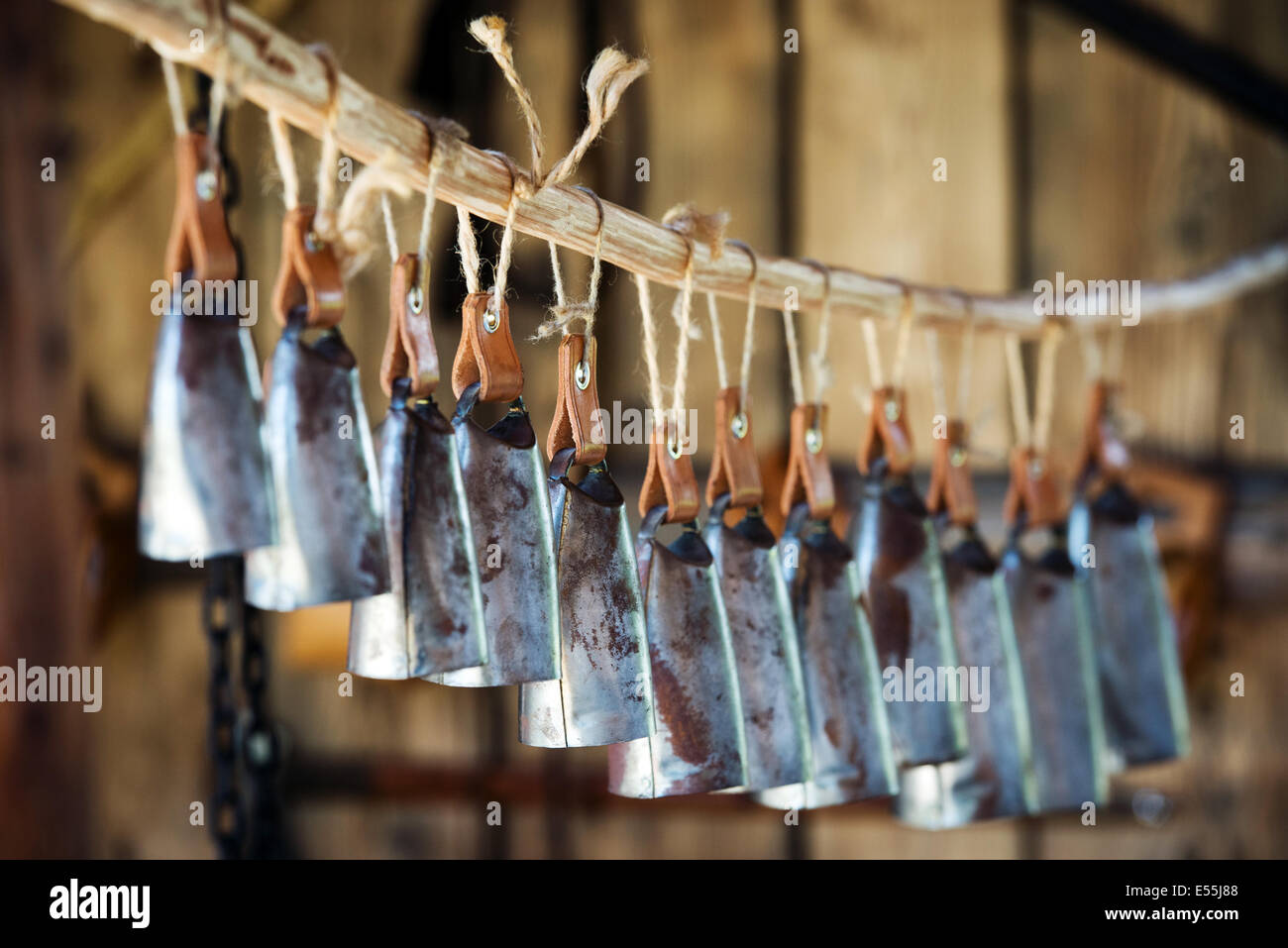 Cattle bells in a row Stock Photo - Alamy
