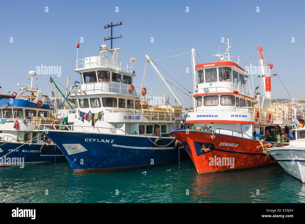 Colourful Turkish fishing boats moored in the harbour at Güvercin Adasi ...