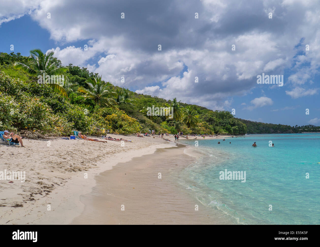 People enjoying Hawksnest Bay Beach on the Caribbean Island of St John ...
