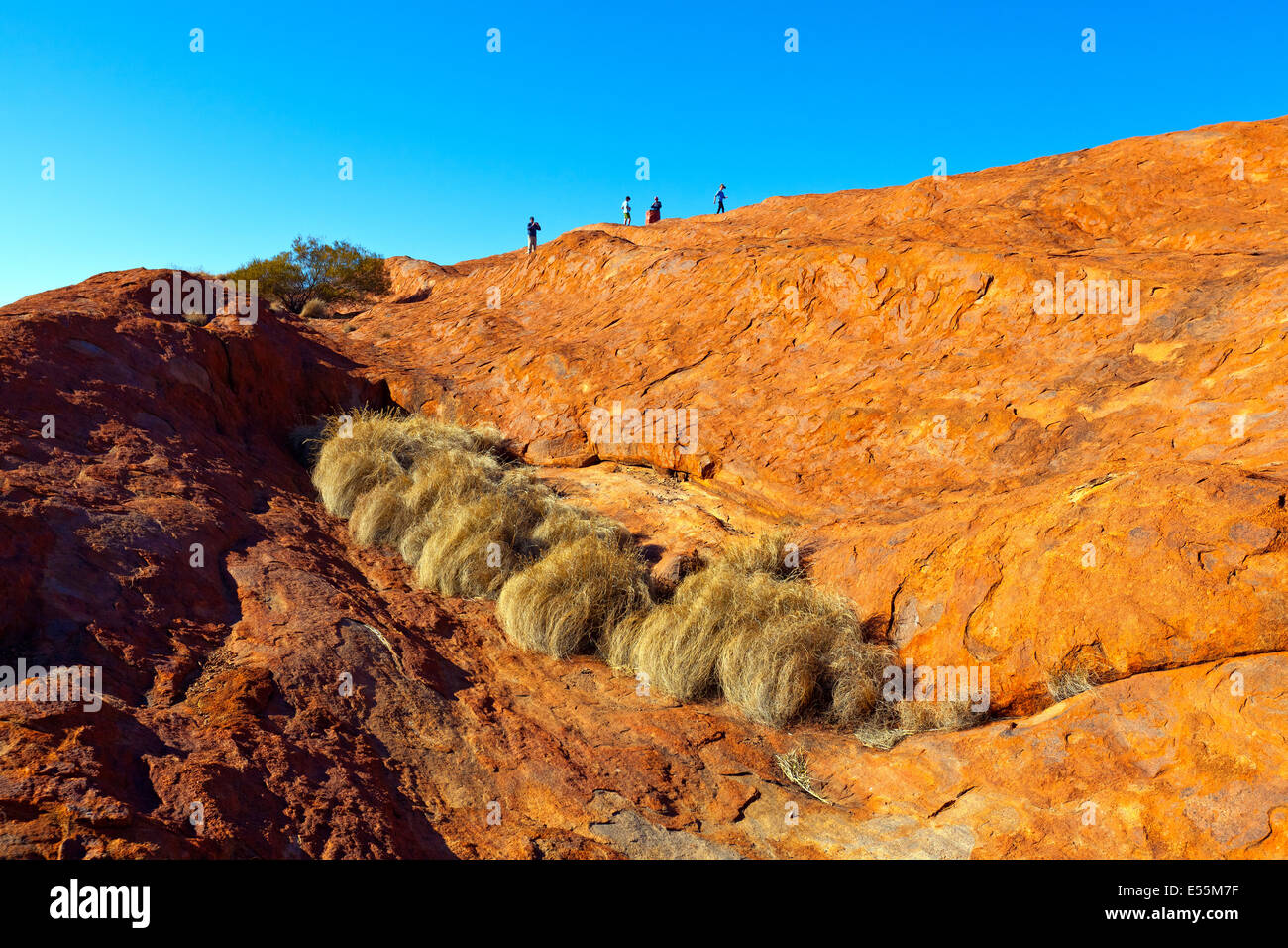outback landscape red rock people hiking Uluru Ayers Central Australia ...