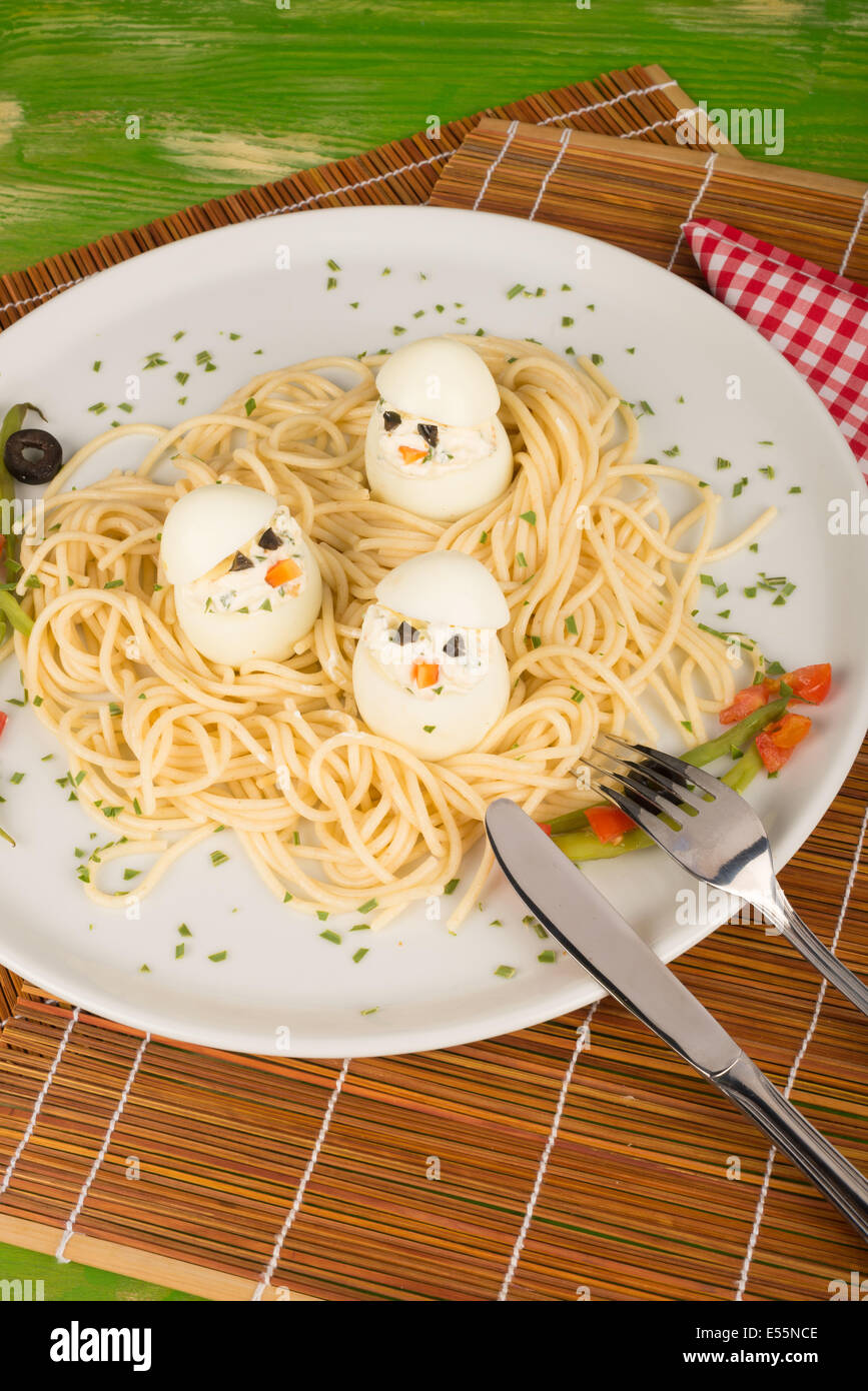 A funny pasta dish looking like birds in a nest, kid food Stock Photo ...