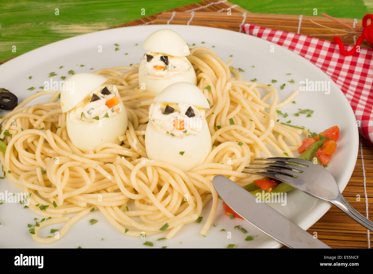 A funny pasta dish looking like birds in a nest, kid food Stock Photo ...