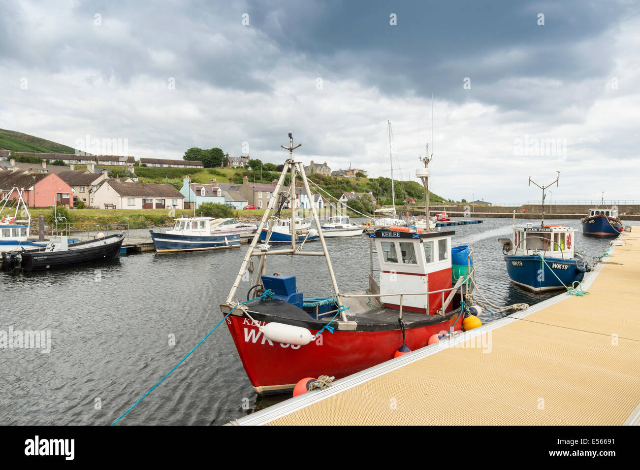 FISHING BOATS RED AND BLUE MOORED IN HELMSDALE HARBOUR SUTHERLAND ...