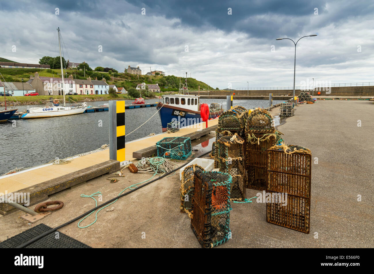 HELMSDALE HARBOUR SUTHERLAND SCOTLAND WITH BLUE CRAB BOAT AND CREELS ...
