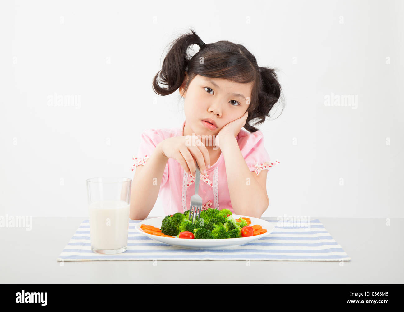 Asian chinese little girl no appetite Stock Photo - Alamy
