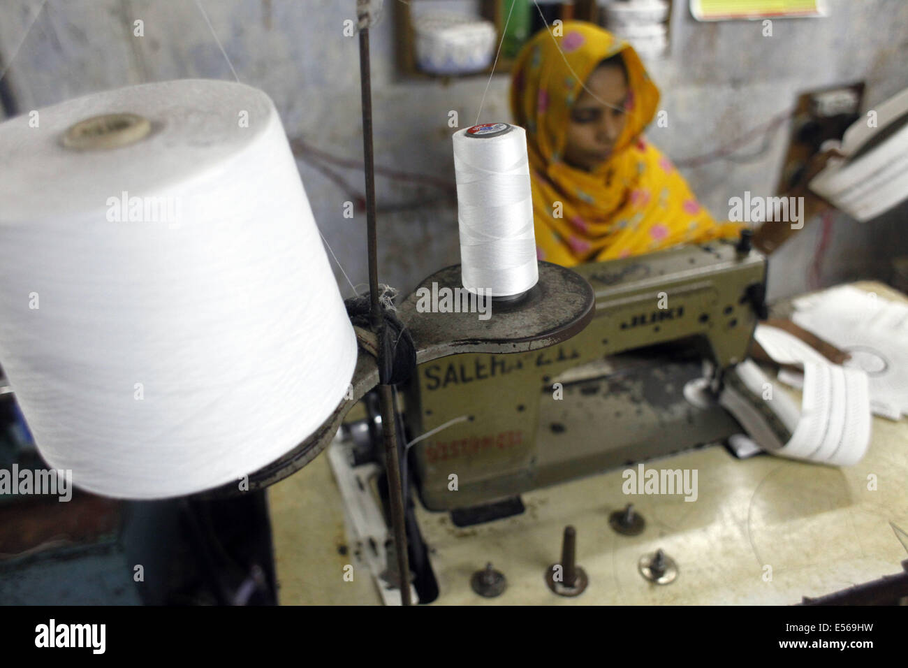 Dhaka, Bangladesh. 22nd July, 2014. Worker making Islamic Tupi (cap) in ...