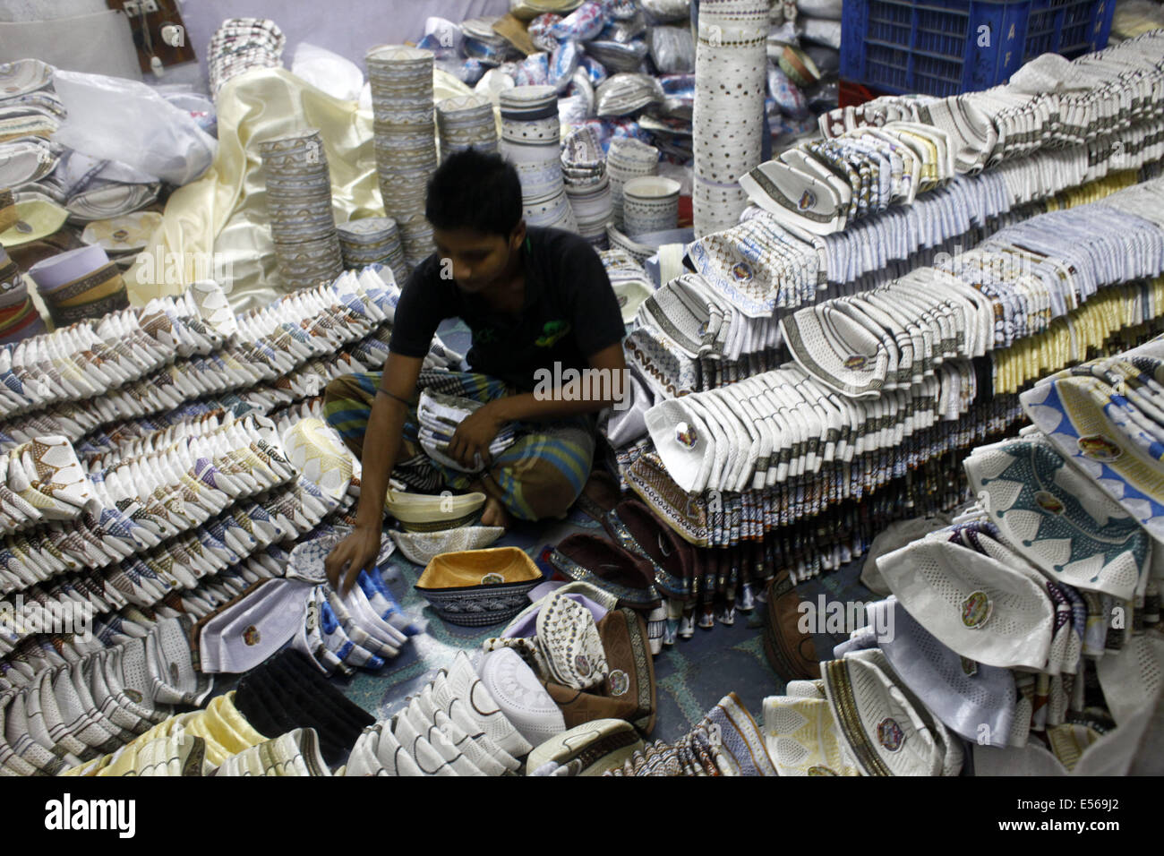 Dhaka, Bangladesh. 22nd July, 2014. Worker making Islamic Tupi (cap) in ...
