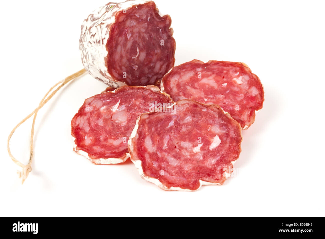 pile of red salami, isolated on a white background Stock Photo - Alamy