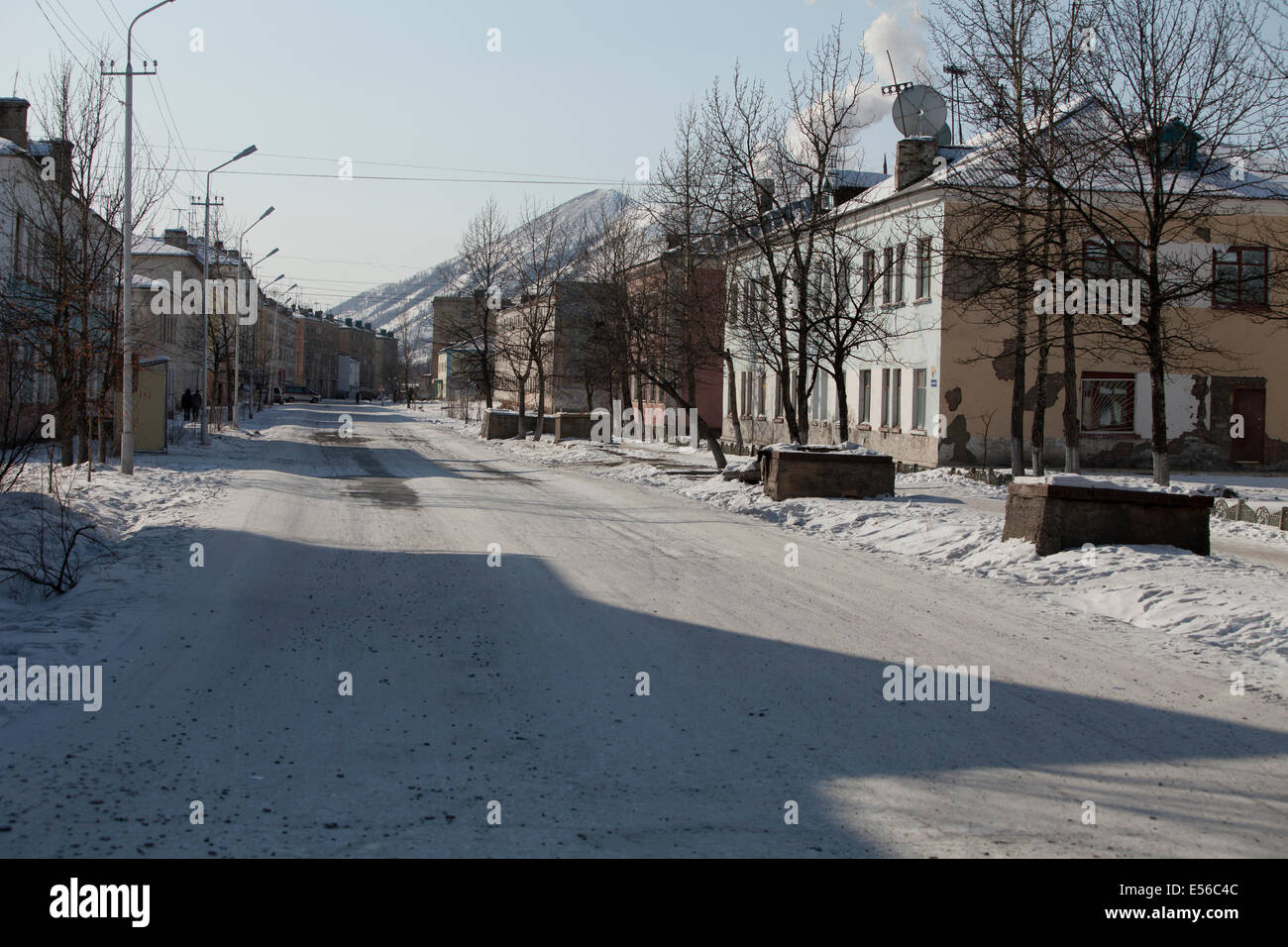 Russian town buildings block snow deserted street Stock Photo - Alamy