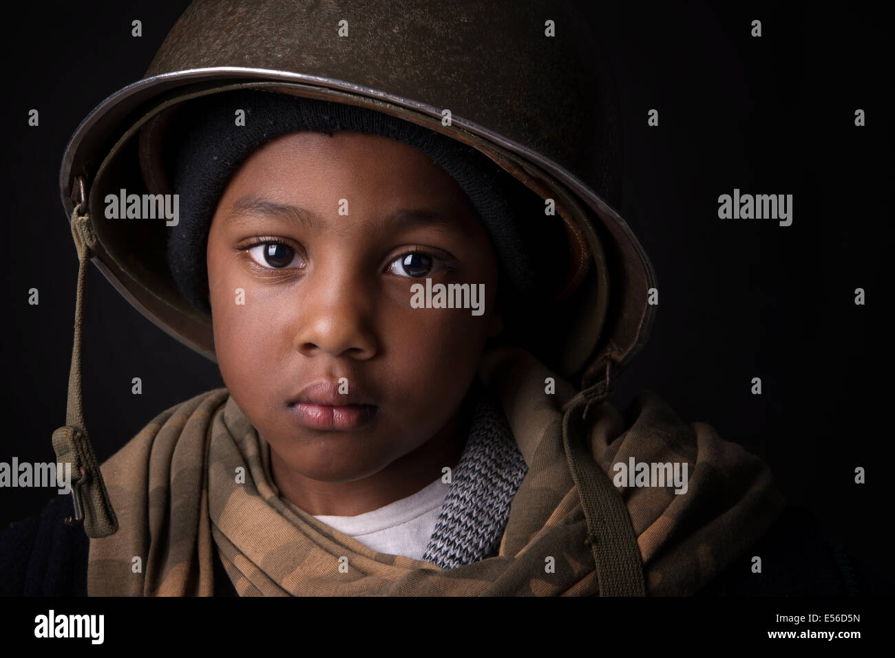 Young boy soldier portrait in a dark background Stock Photo - Alamy