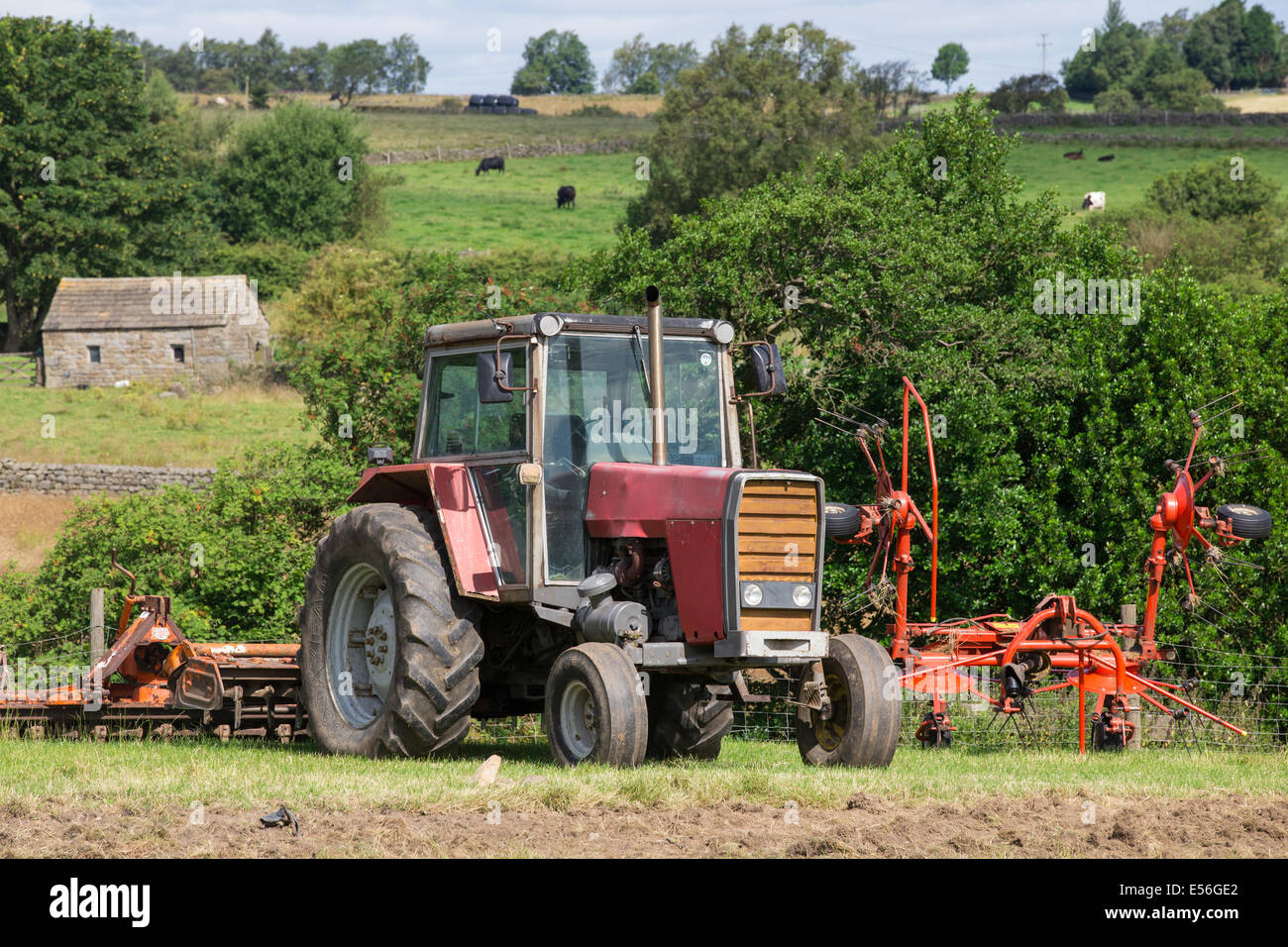 Tractor mowing and cutting the hay silage Stock Photo - Alamy