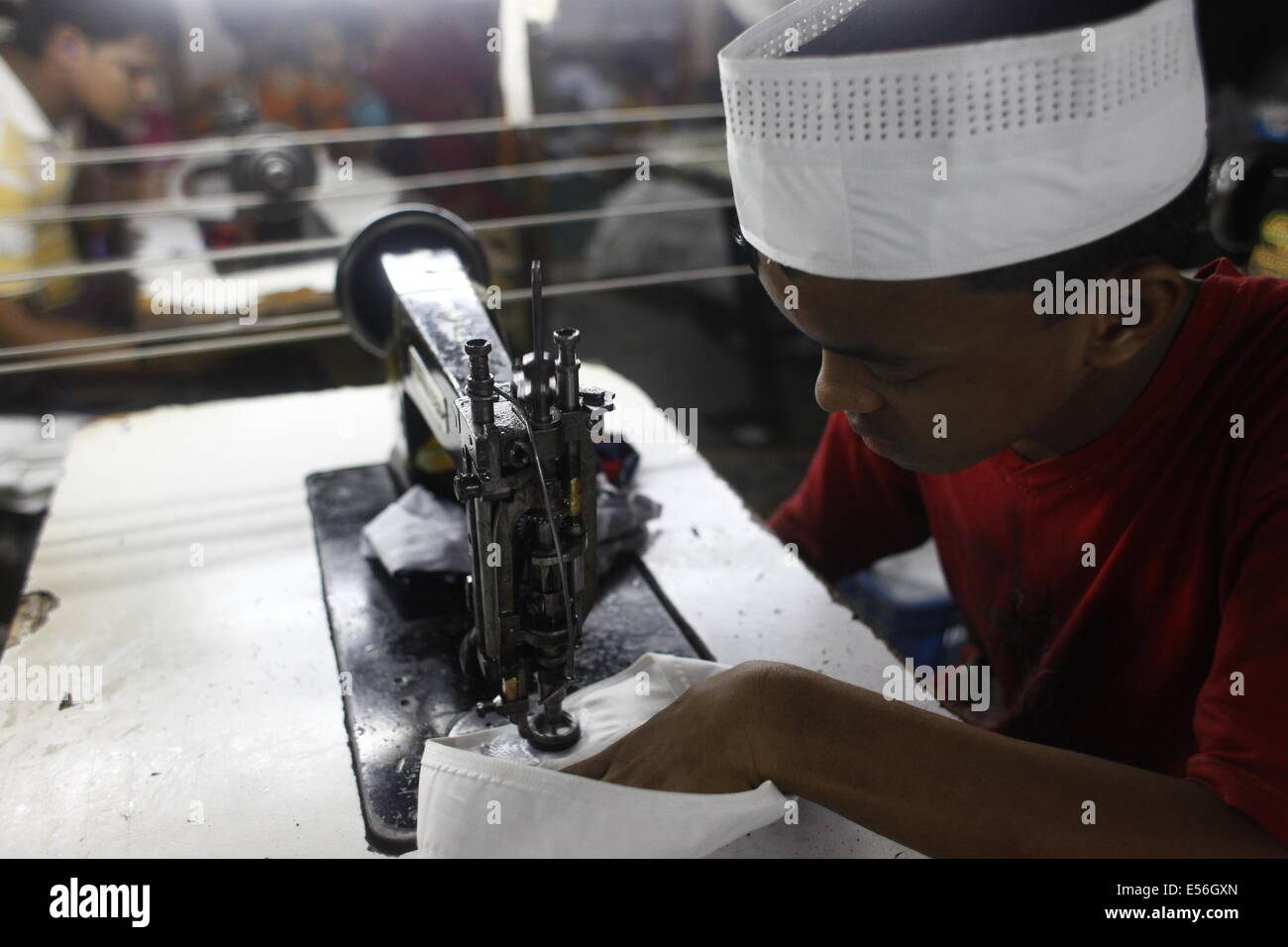 Worker making Islamic Tupi (cap) in a factory in Bangladesh on the ...