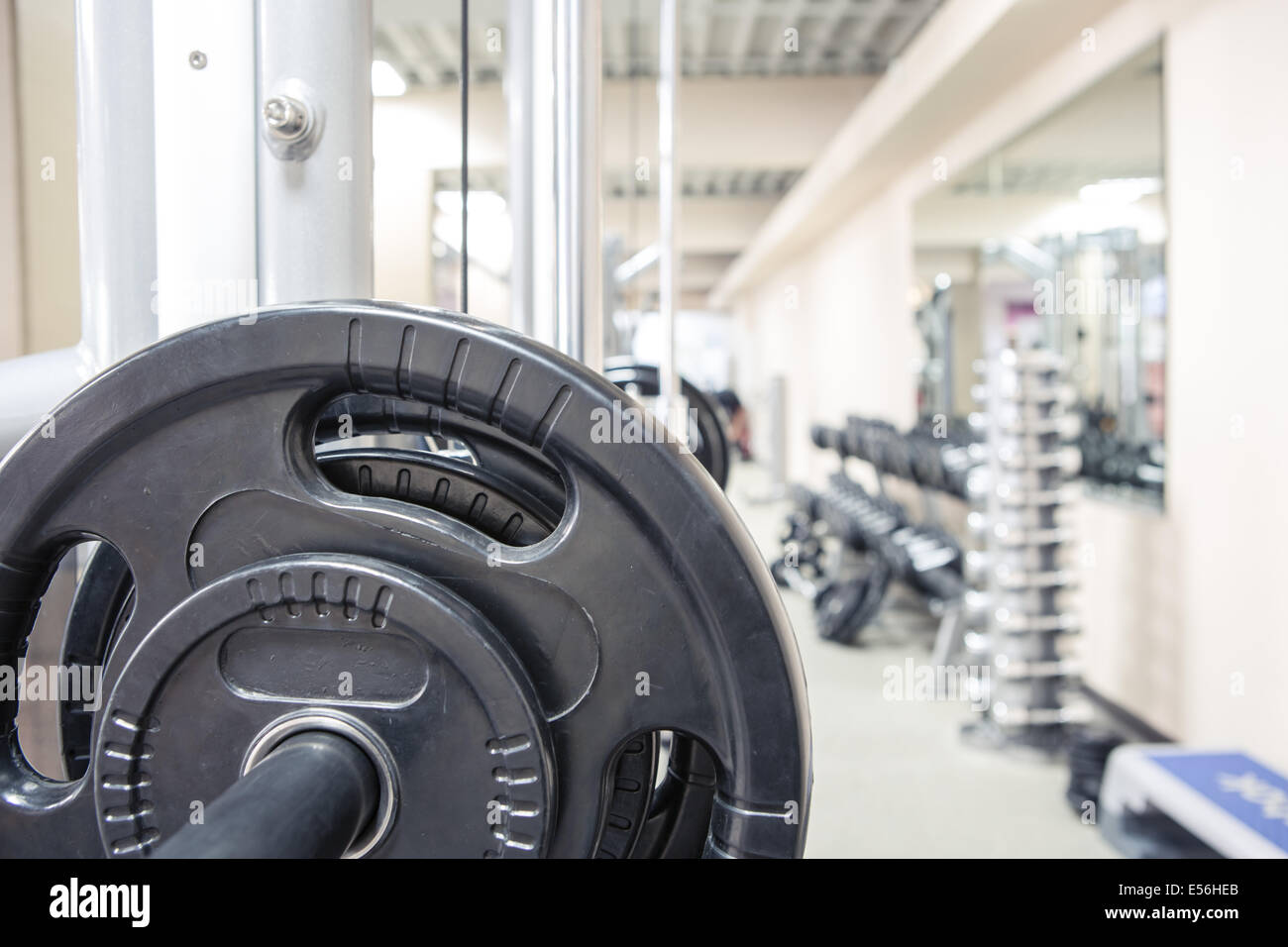 diverse equipment and machines at the gym room Stock Photo - Alamy