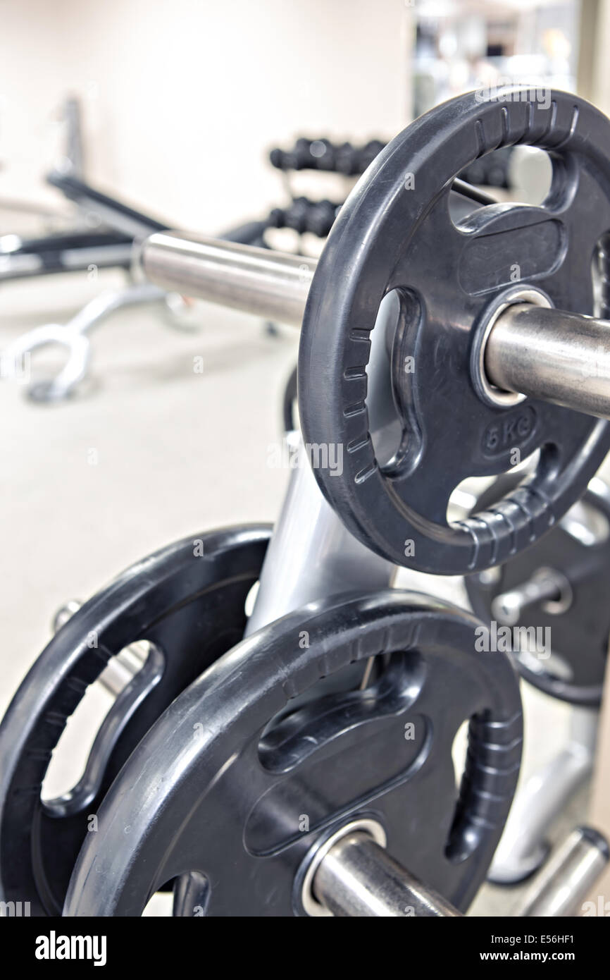 diverse equipment and machines at the gym room Stock Photo - Alamy