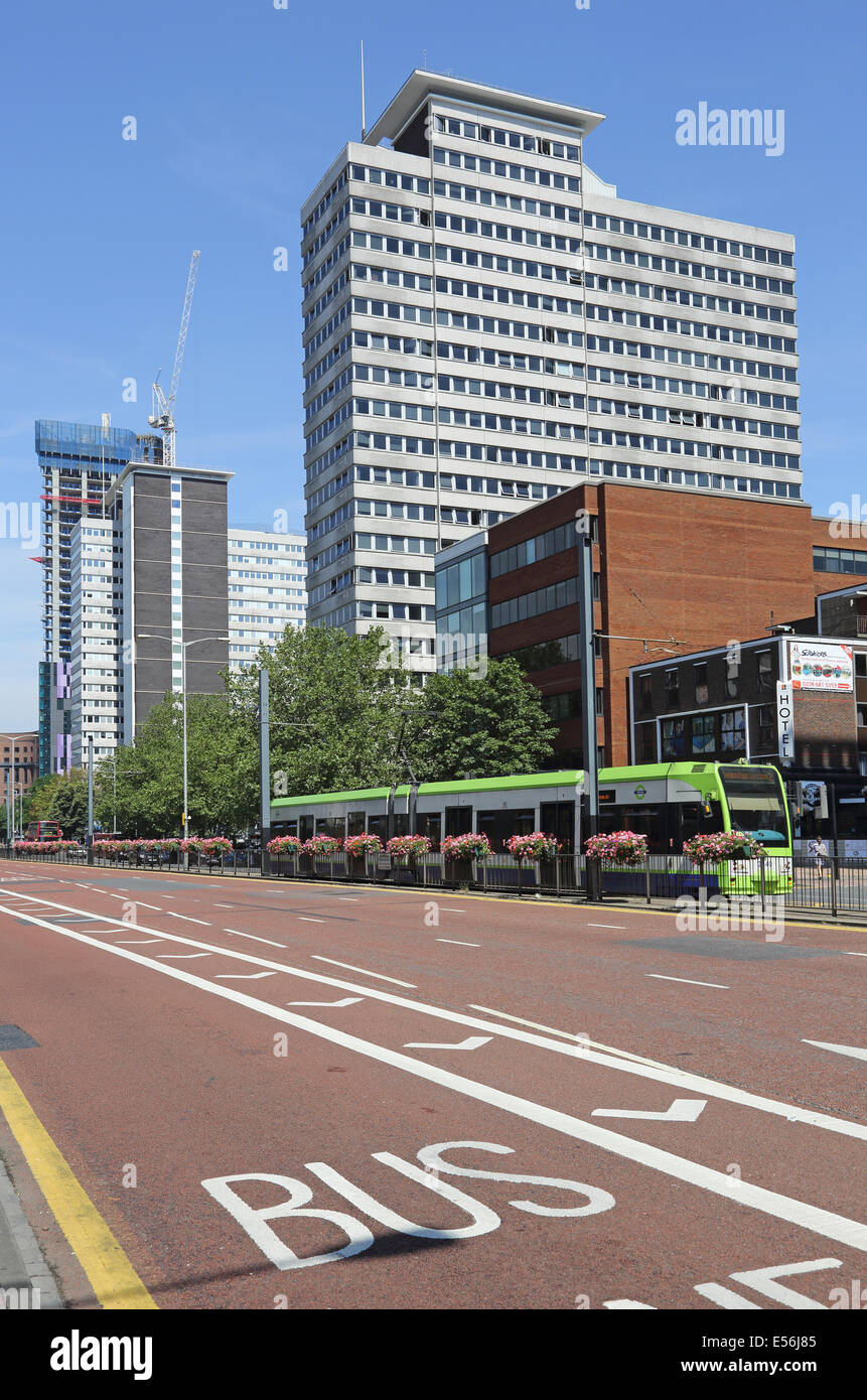 A tram travels down Wellesley Road, Croydon, UK. A modern, urban dual ...