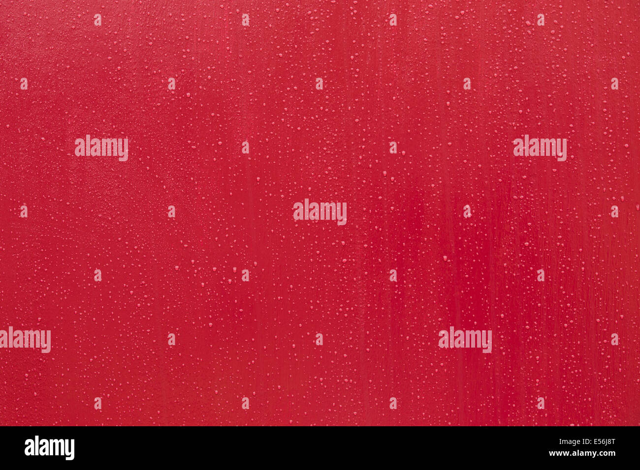 Water droplets on red paint Stock Photo - Alamy