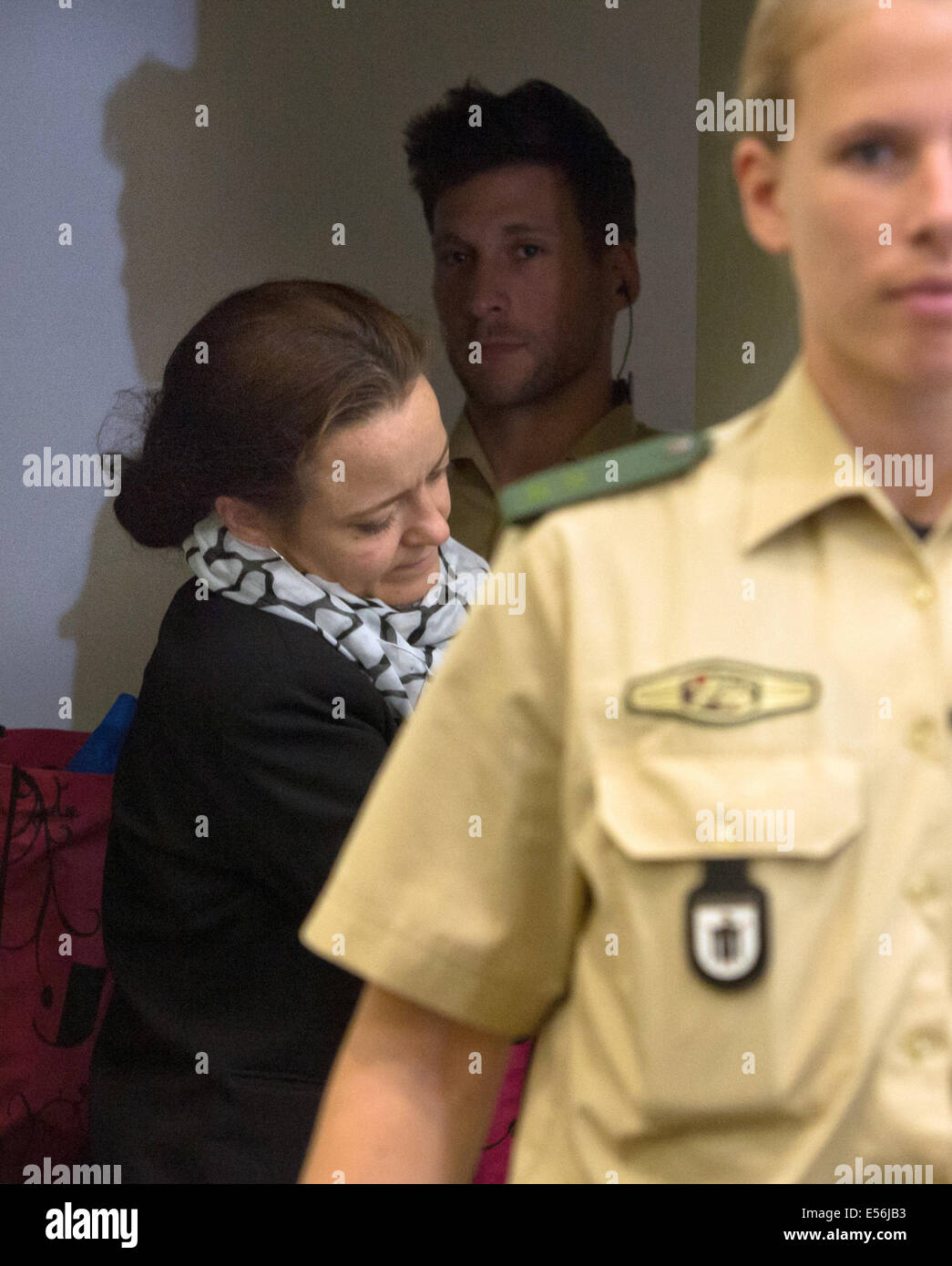 Defendant Beate Zschaepe (L) enters the courtroom at the regional court ...