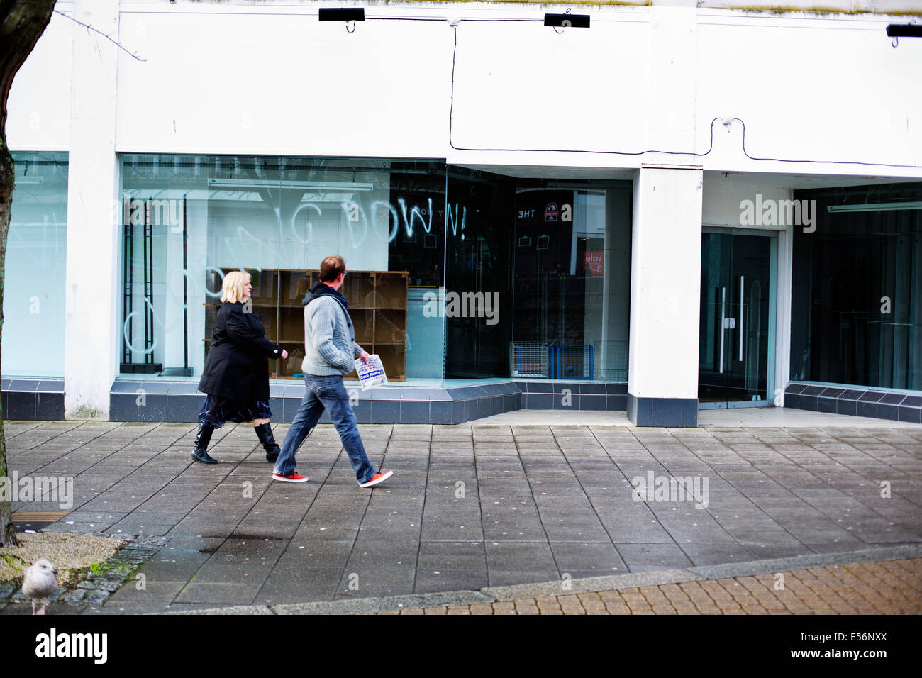 A run down street in Plymouth showing empty closed down shops Stock ...