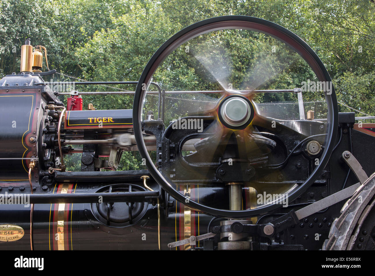Moving flywheel and push-rod, traction engine Stock Photo - Alamy