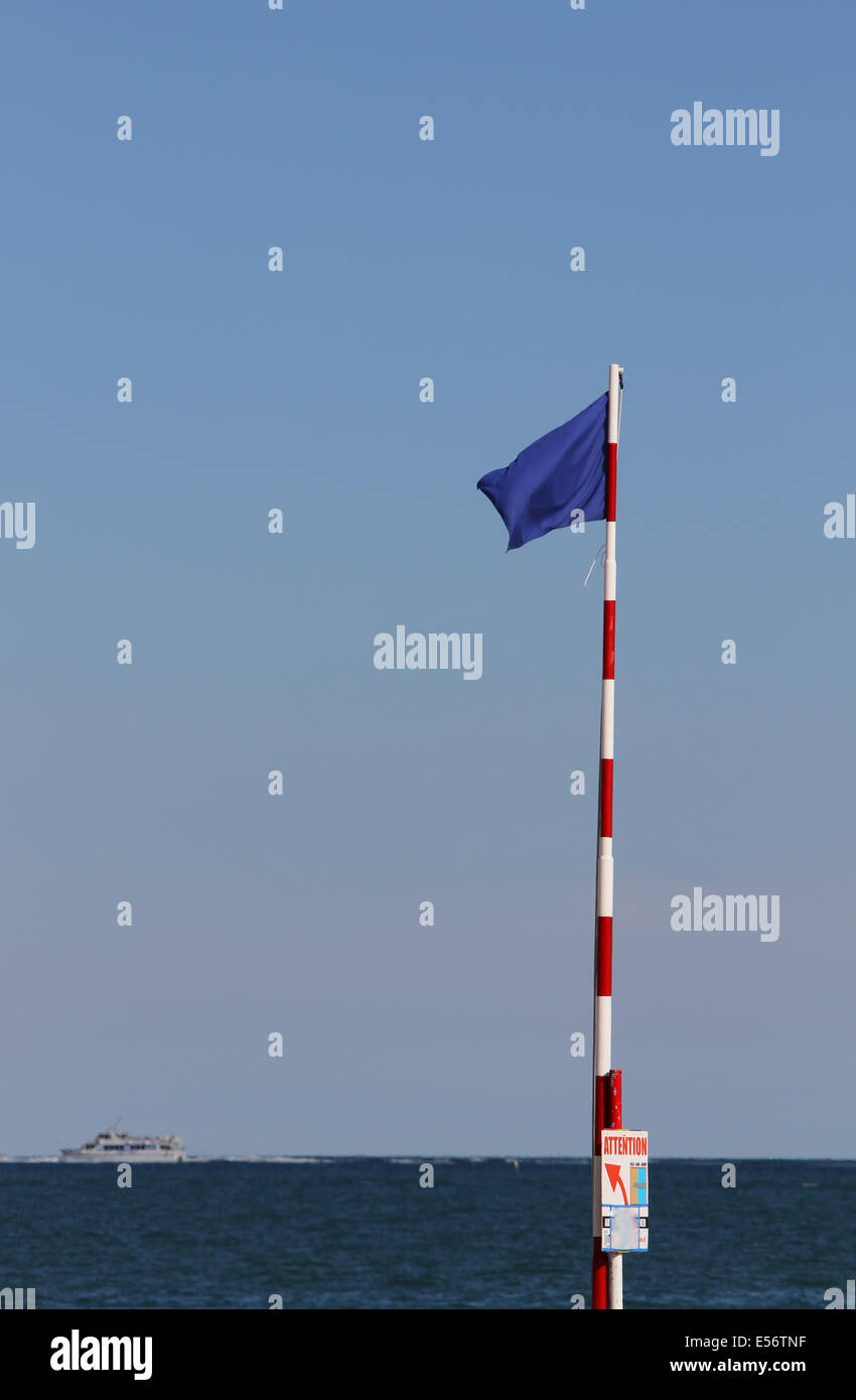 blue flag near the sea Stock Photo - Alamy