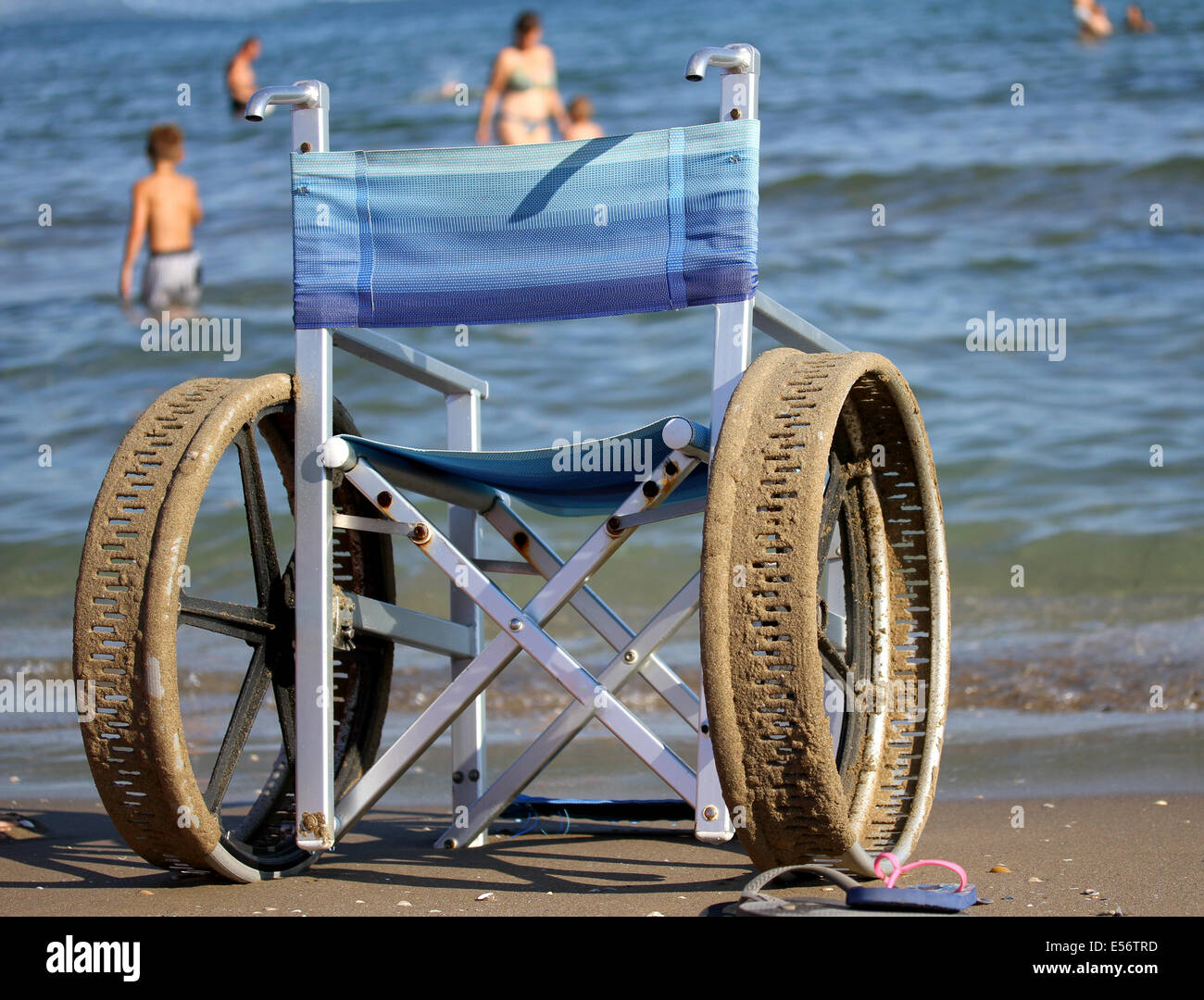 Special wheelchair with perforated wheels for swimming in the sea of ...