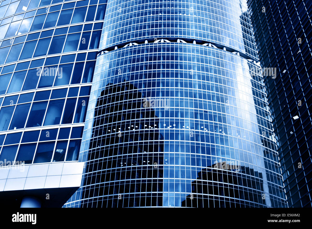 Modern skyscrapers close-up toned in blue color Stock Photo - Alamy