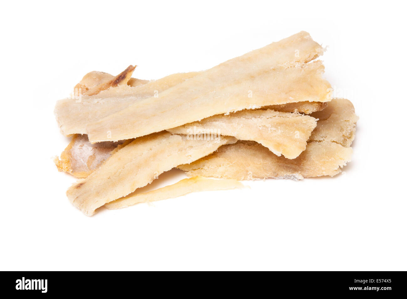 Pieces of salt cod fish isolated on a white studio background Stock ...